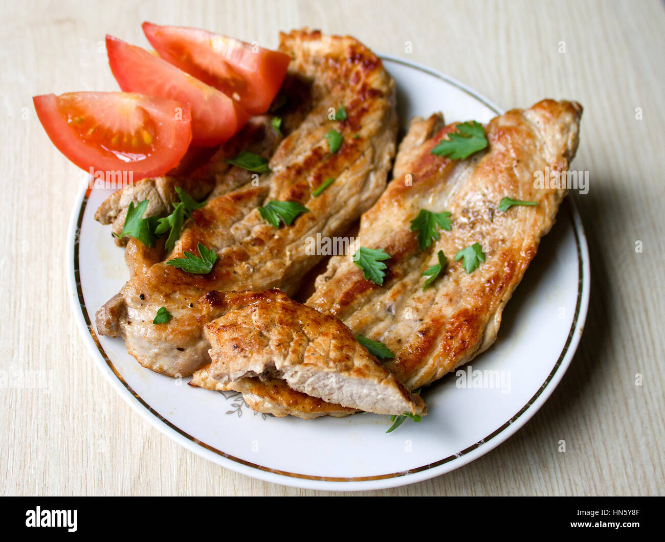grilled pork neck with rosemary and tomatoes, the background Stock ...