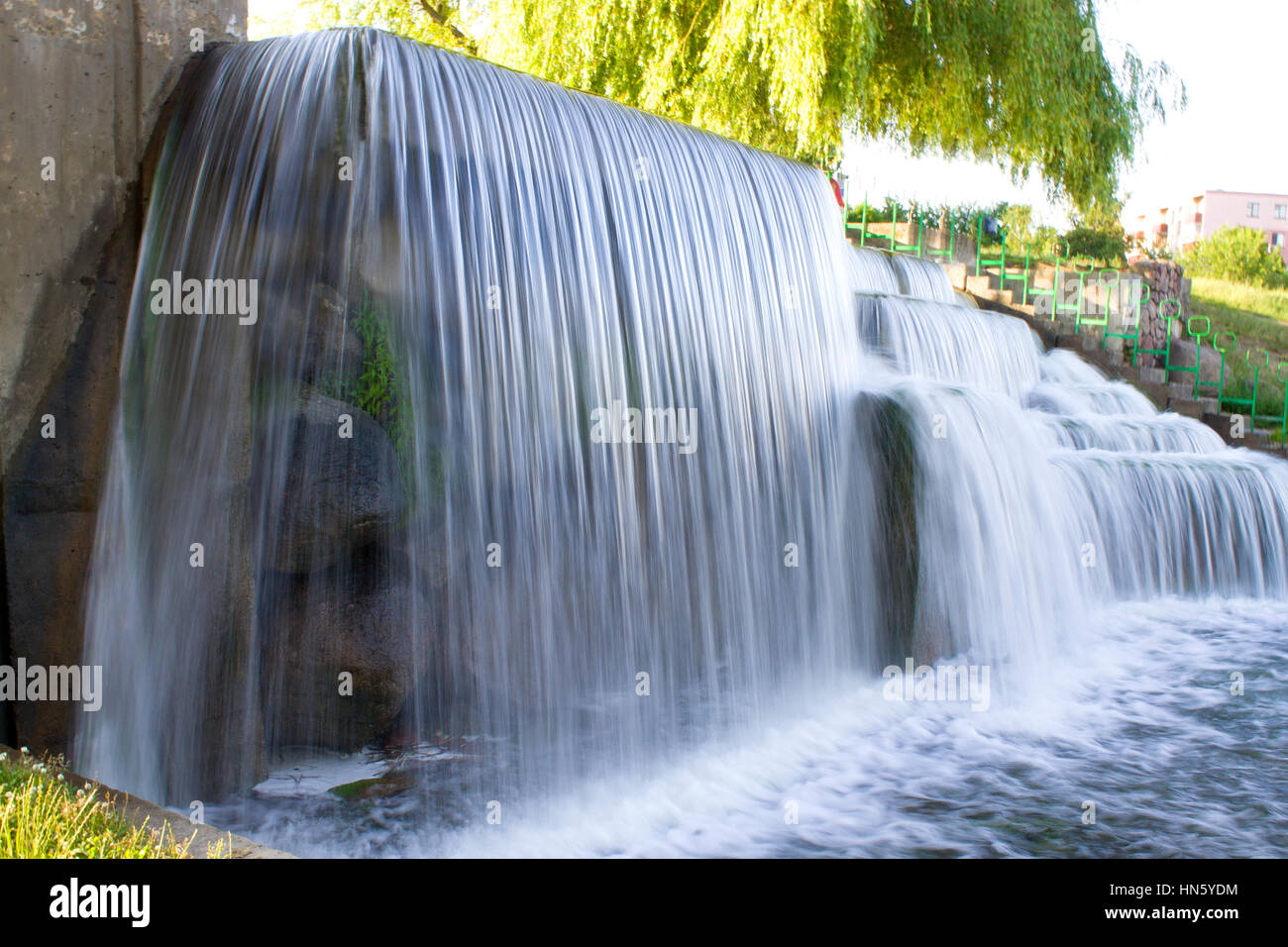 a beautiful waterfall in the city, background Stock Photo - Alamy