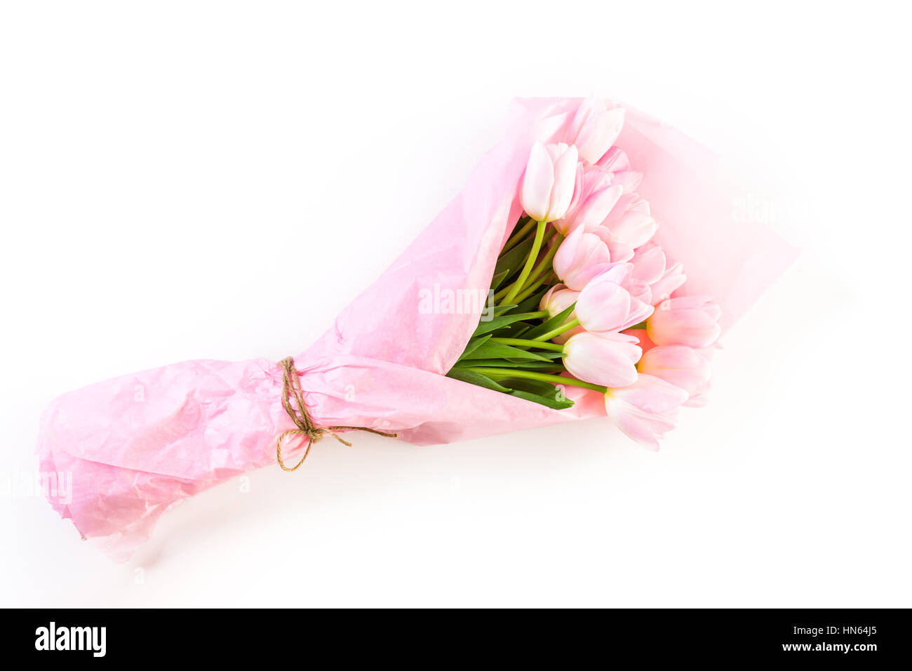 Bouquet of pink tulips wrappen in pink paper Stock Photo - Alamy