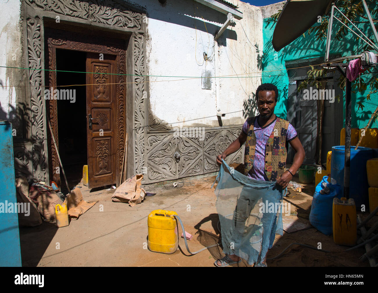 Ethiopian worker restoring an old harari house, Harari Region, Harar ...
