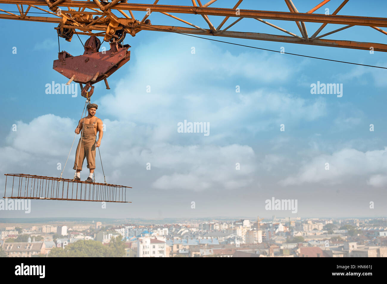 Man male standing on platform ladder hi-res stock photography and ...