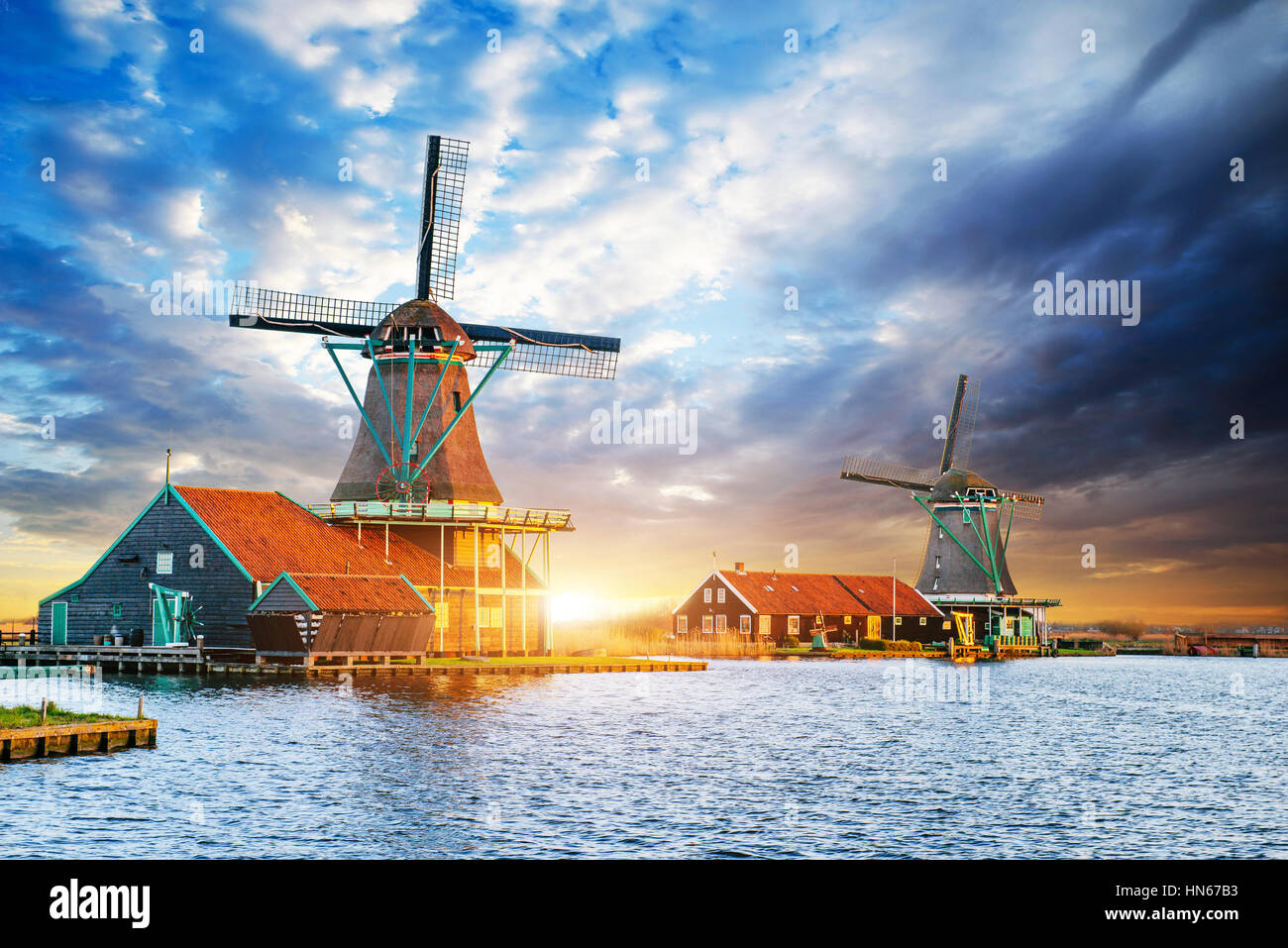 Cumulus clouds on sunset over dutch windmills in Rotterdam. Neth Stock ...