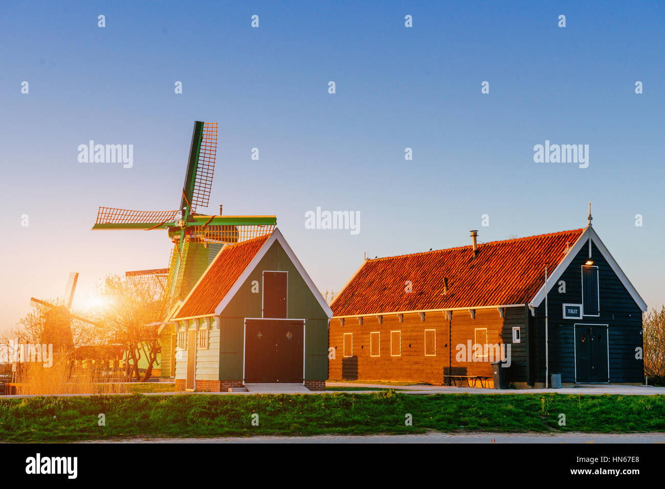Comfortable houses at sunset Stock Photo - Alamy