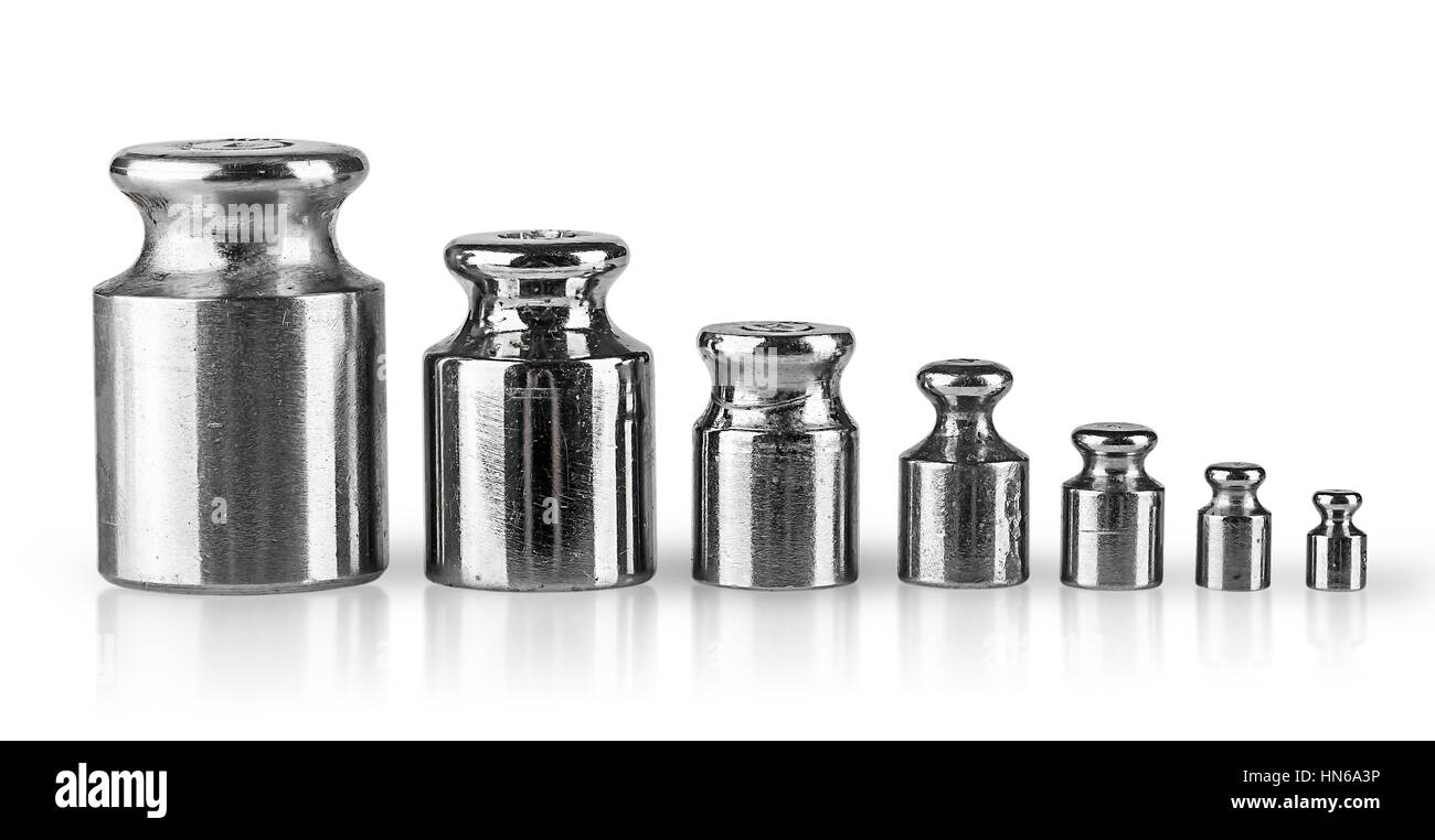 Old worn measuring weights in a row isolated on white background Stock ...