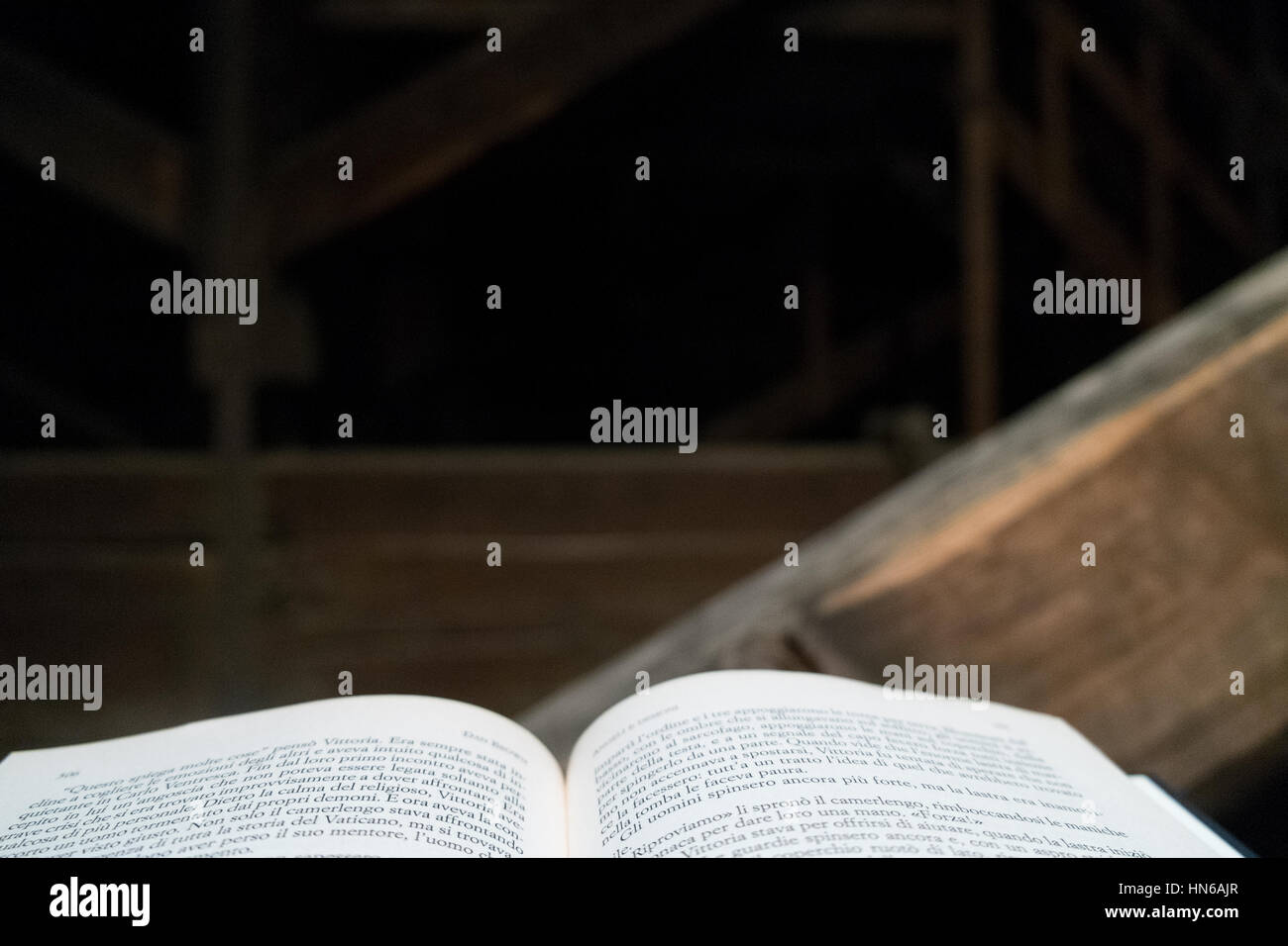 Italian bible page open inside a church Stock Photo - Alamy
