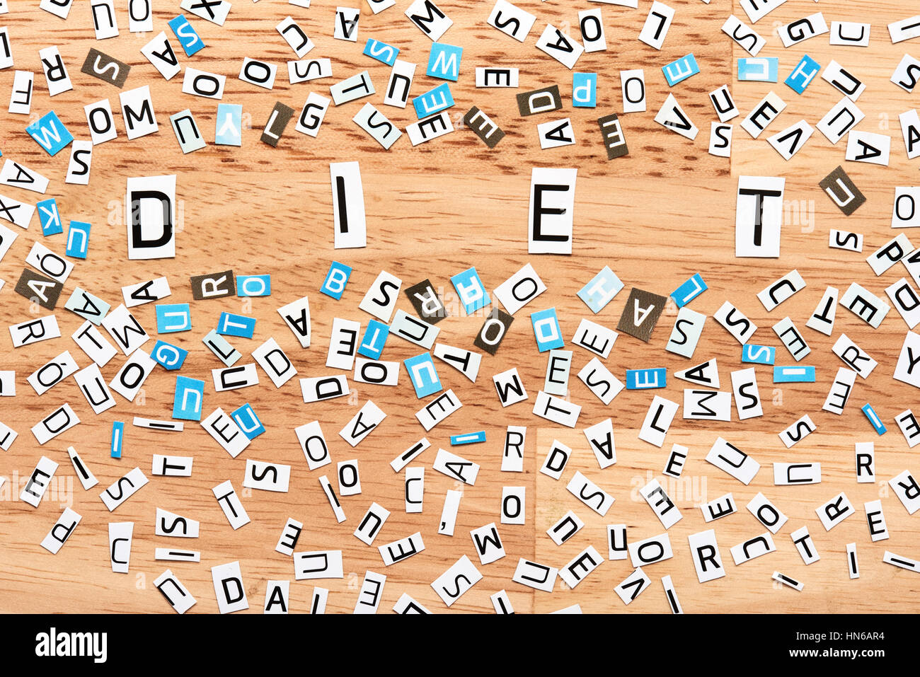 Diet word from cut out letters on wooden table Stock Photo - Alamy