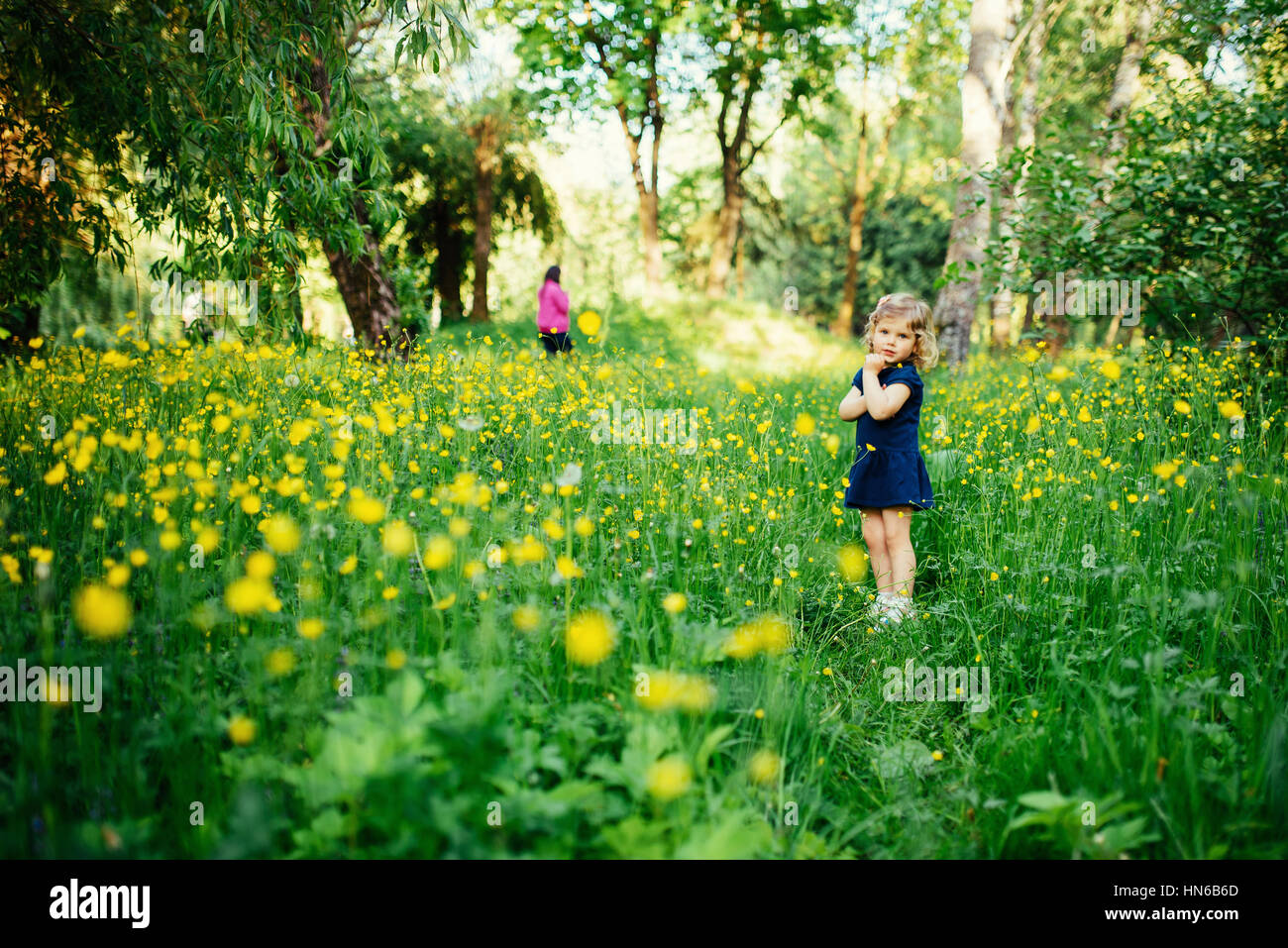 child playing outdoors in the grass Stock Photo - Alamy