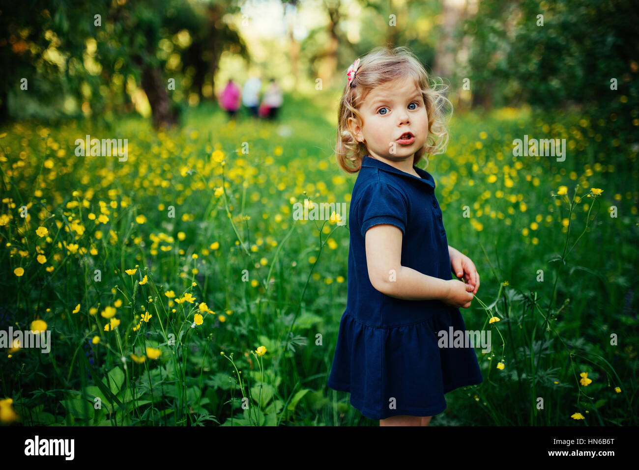 child playing outdoors in the grass Stock Photo - Alamy