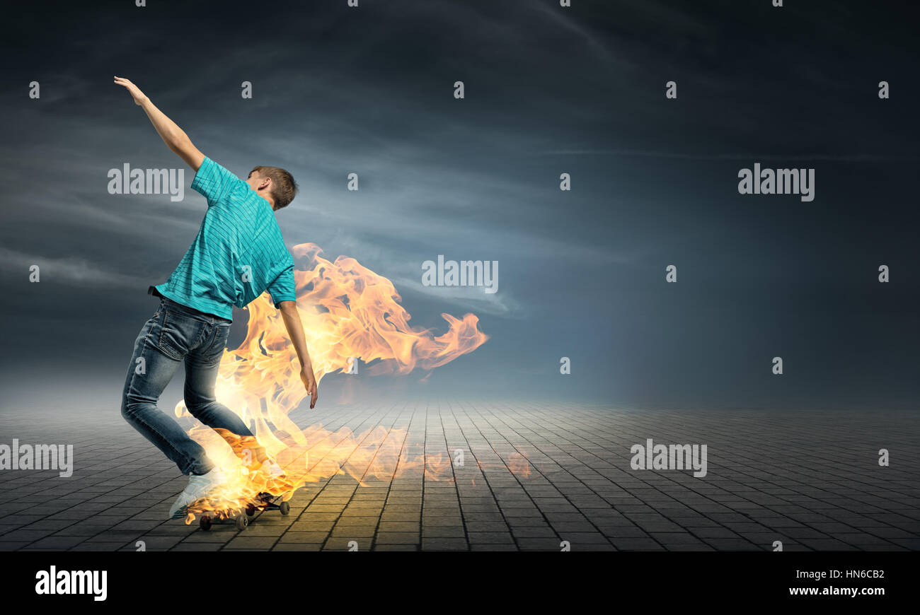 Skater boy riding on his skateboard burning in fire Stock Photo - Alamy
