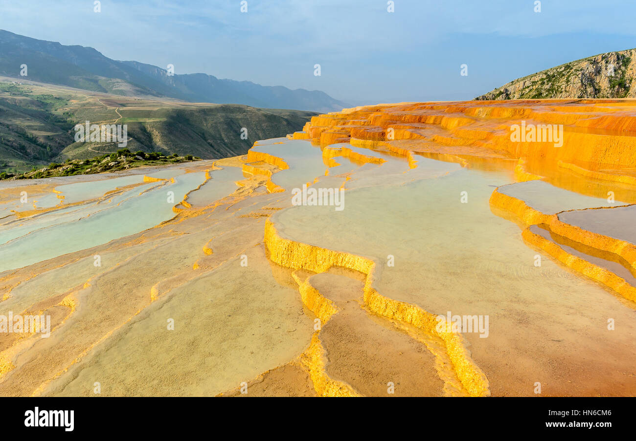 Travertine terrace at sunrise near Orost, one of the rare pure ...