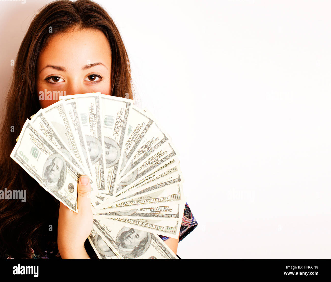 portrait of pretty young woman with money, isolated on white background ...