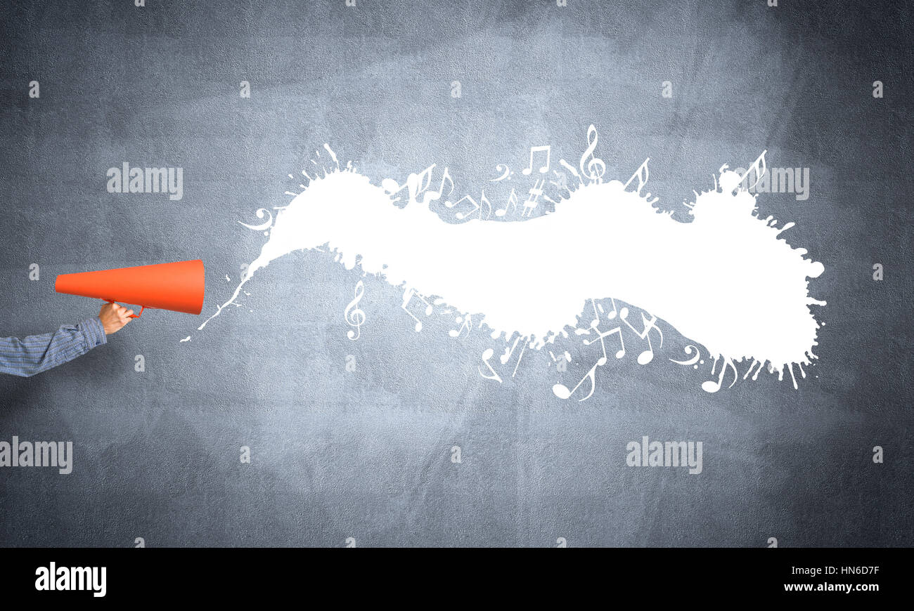 Close of man making announcement in paper trumpet Stock Photo - Alamy