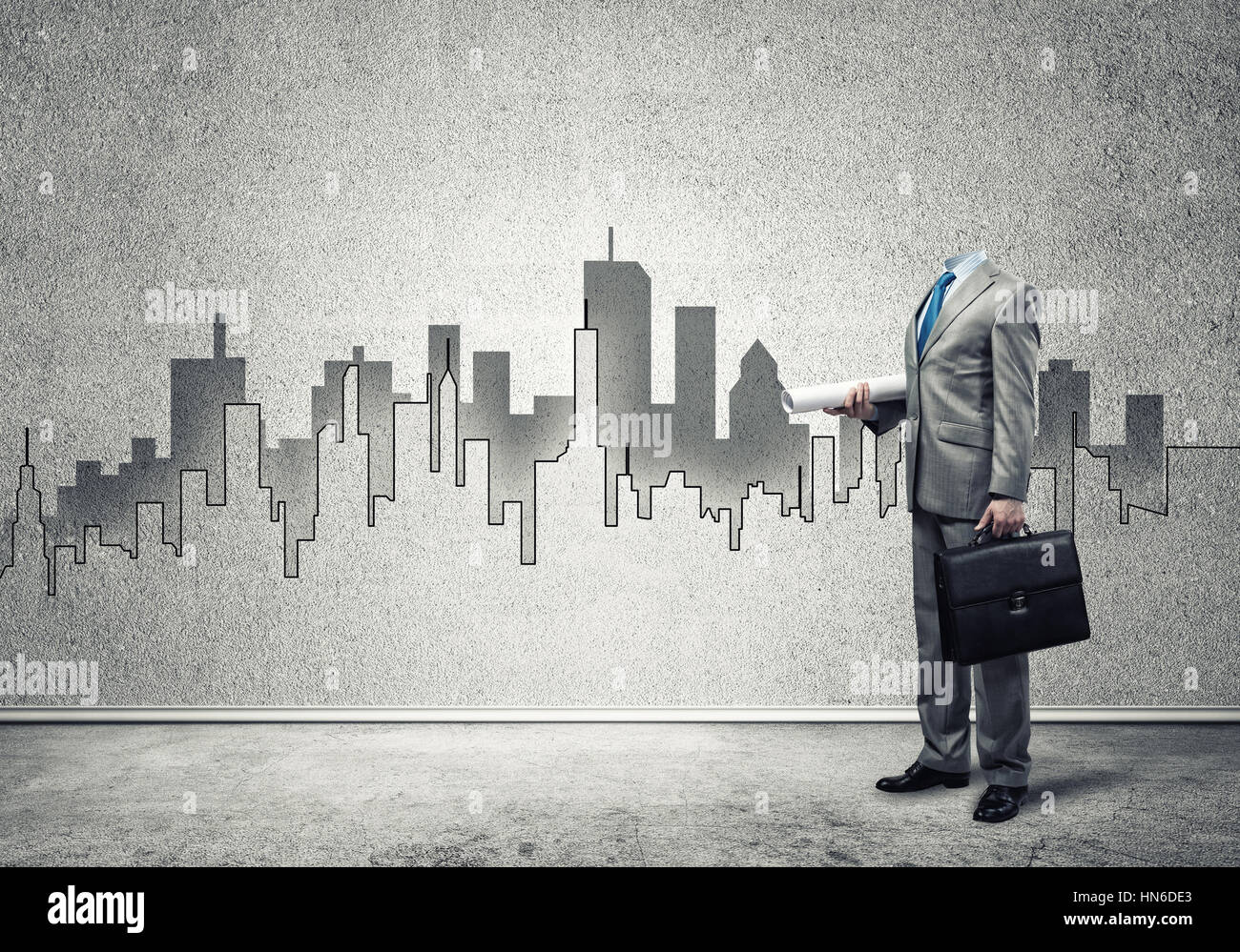 Headless engineer man with papers and case in hand against construction ...