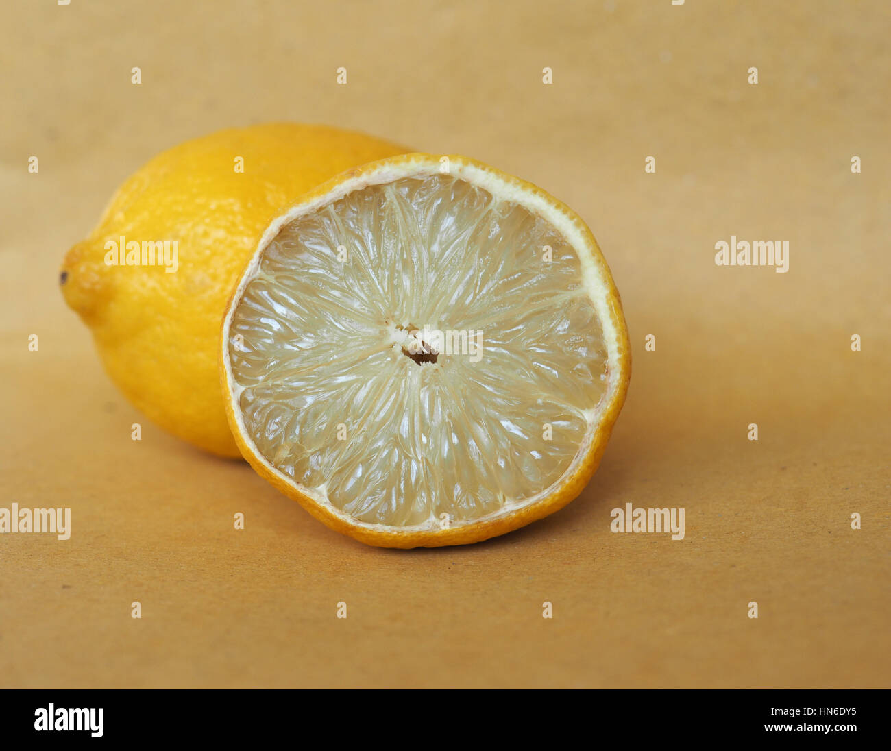 yellow lemon (Citrus x limon) whole fruit and sliced Stock Photo - Alamy