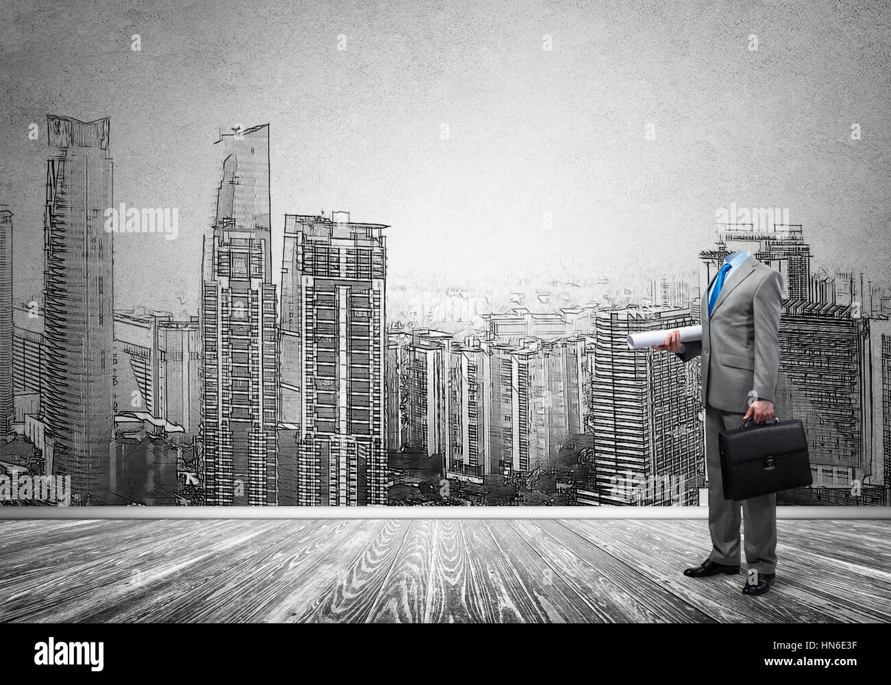Headless engineer man with papers in hand against construction ...