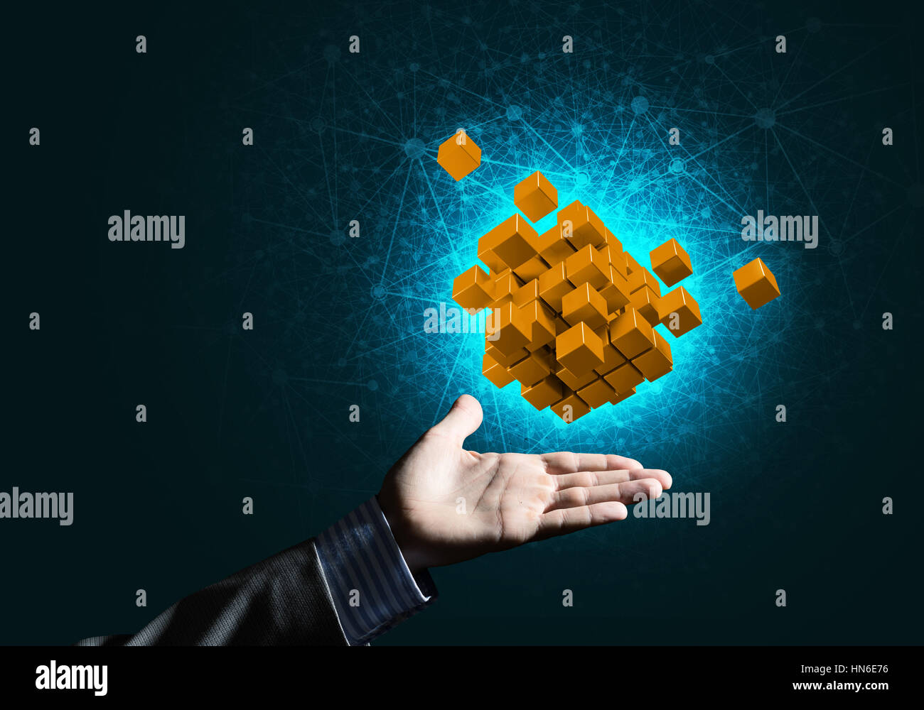 Close of businessman hand holding cube figure as symbol of innovation ...
