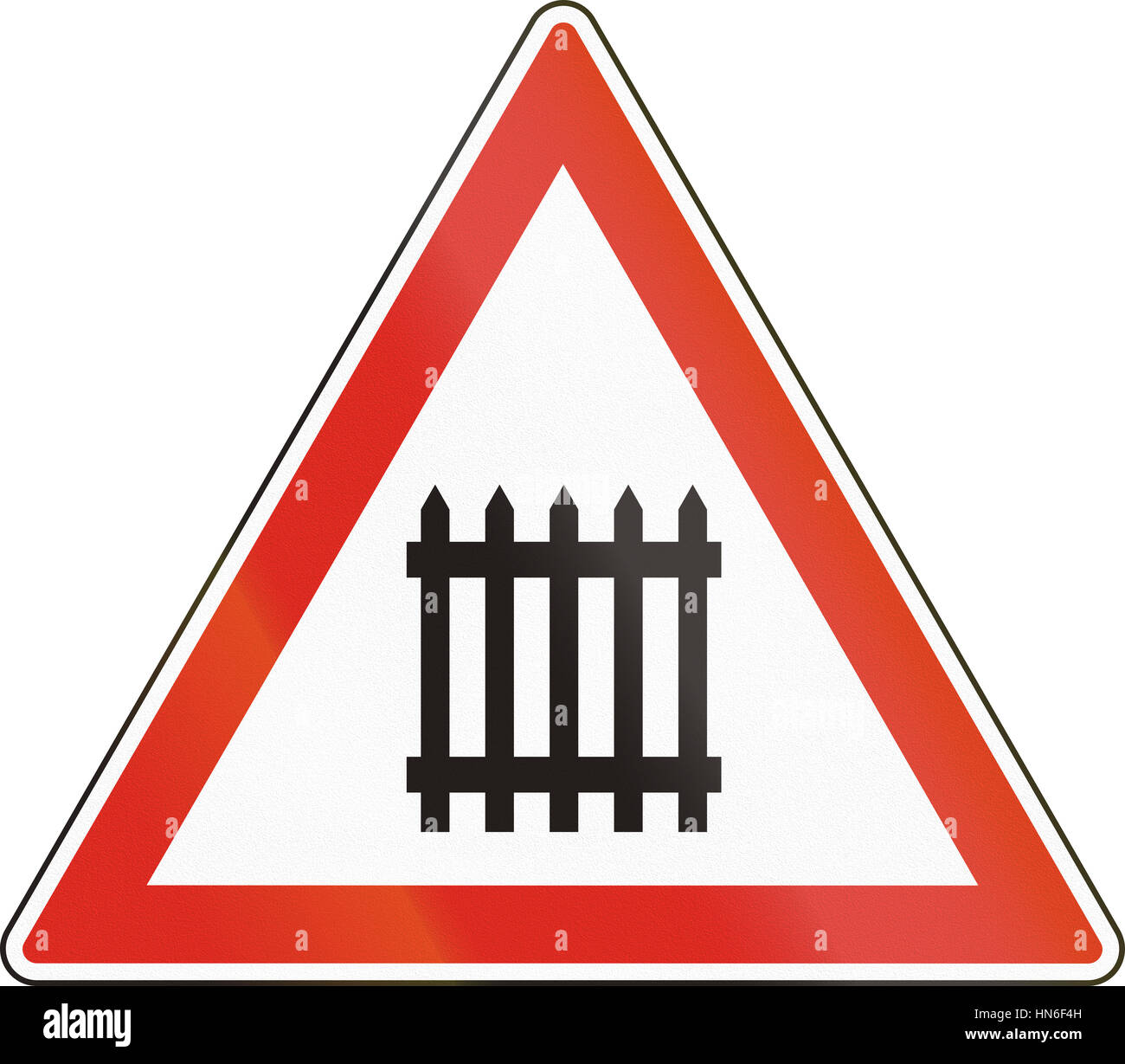 Hungarian warning road sign - level crossing with gates Stock Photo - Alamy