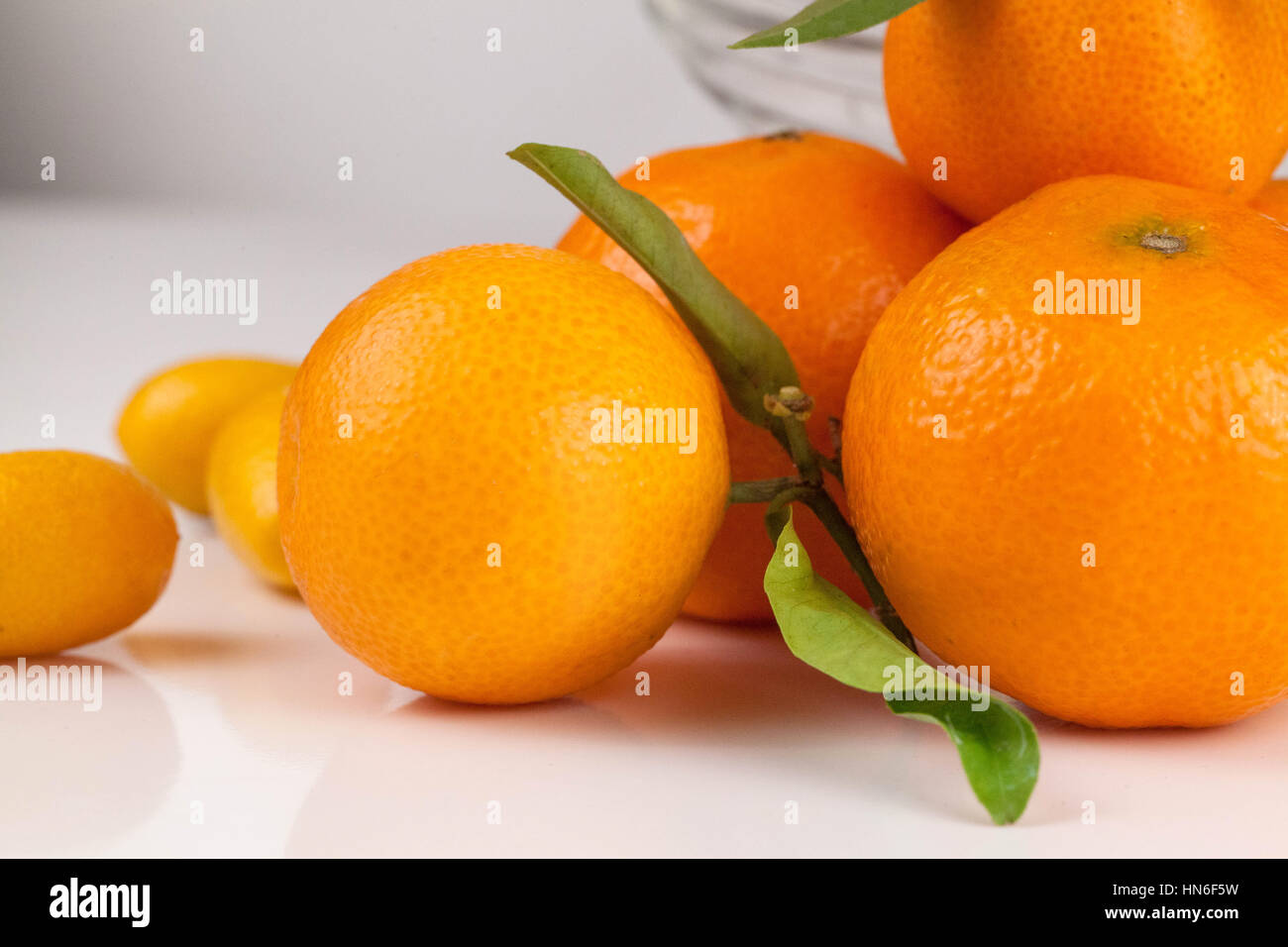 Surface covered with multiple ripe fresh juicy tangerines ...