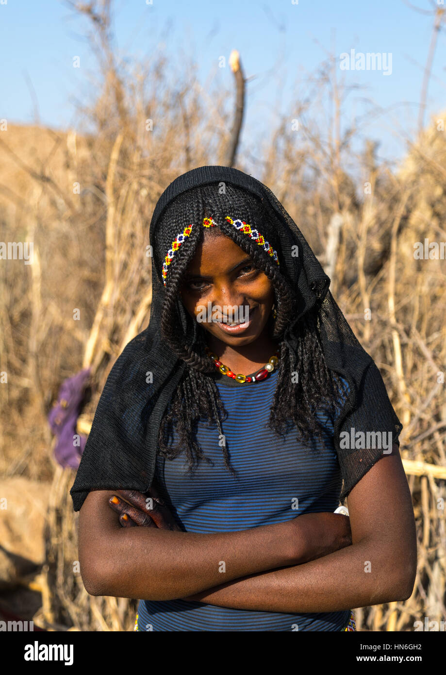 Portrait Of A Smiling Afar Tribe Girl With Braided Hair Afar Region