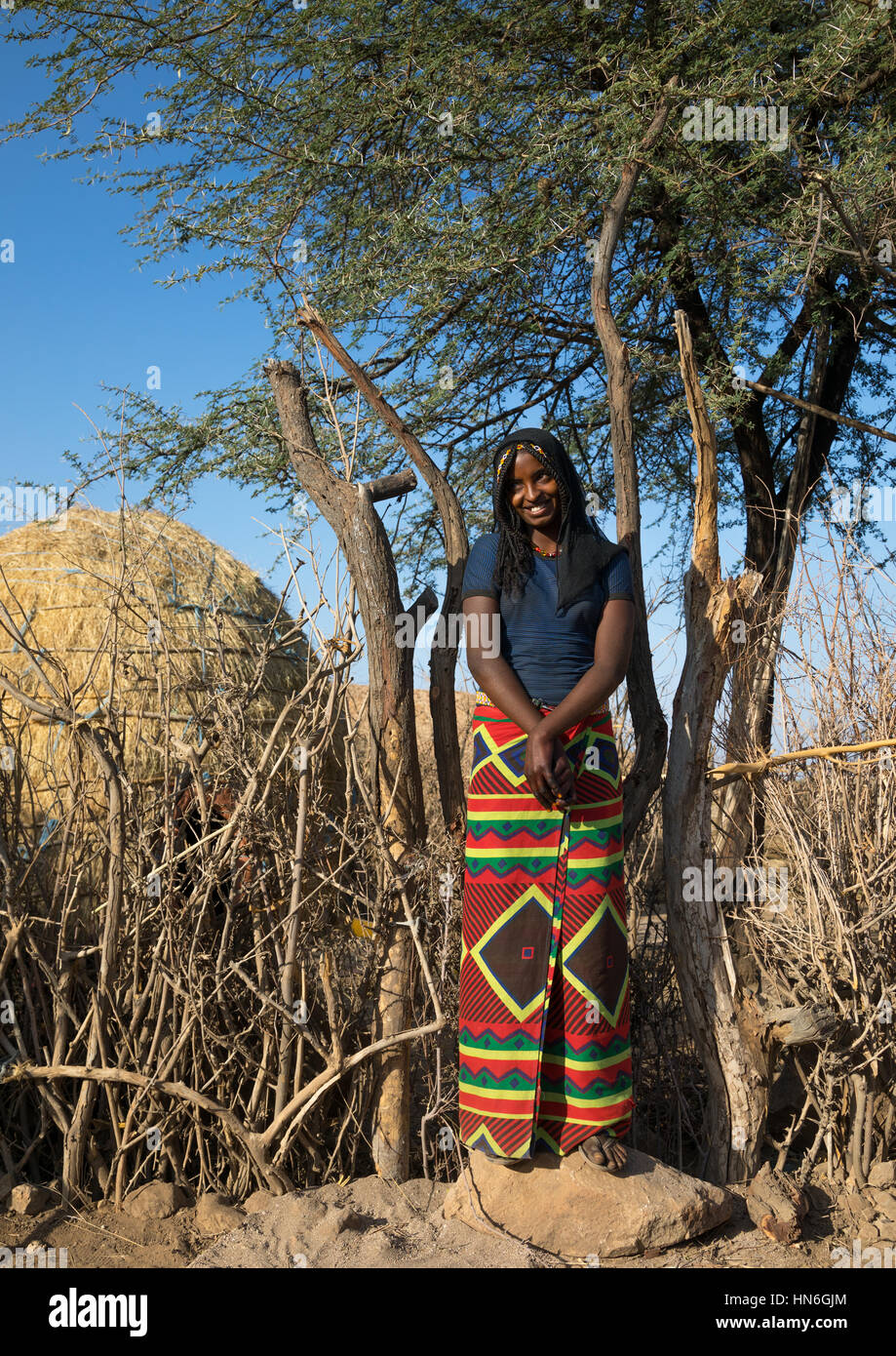 Portrait of an Afar tribe girl in front of her hut, Afar region, Chifra ...