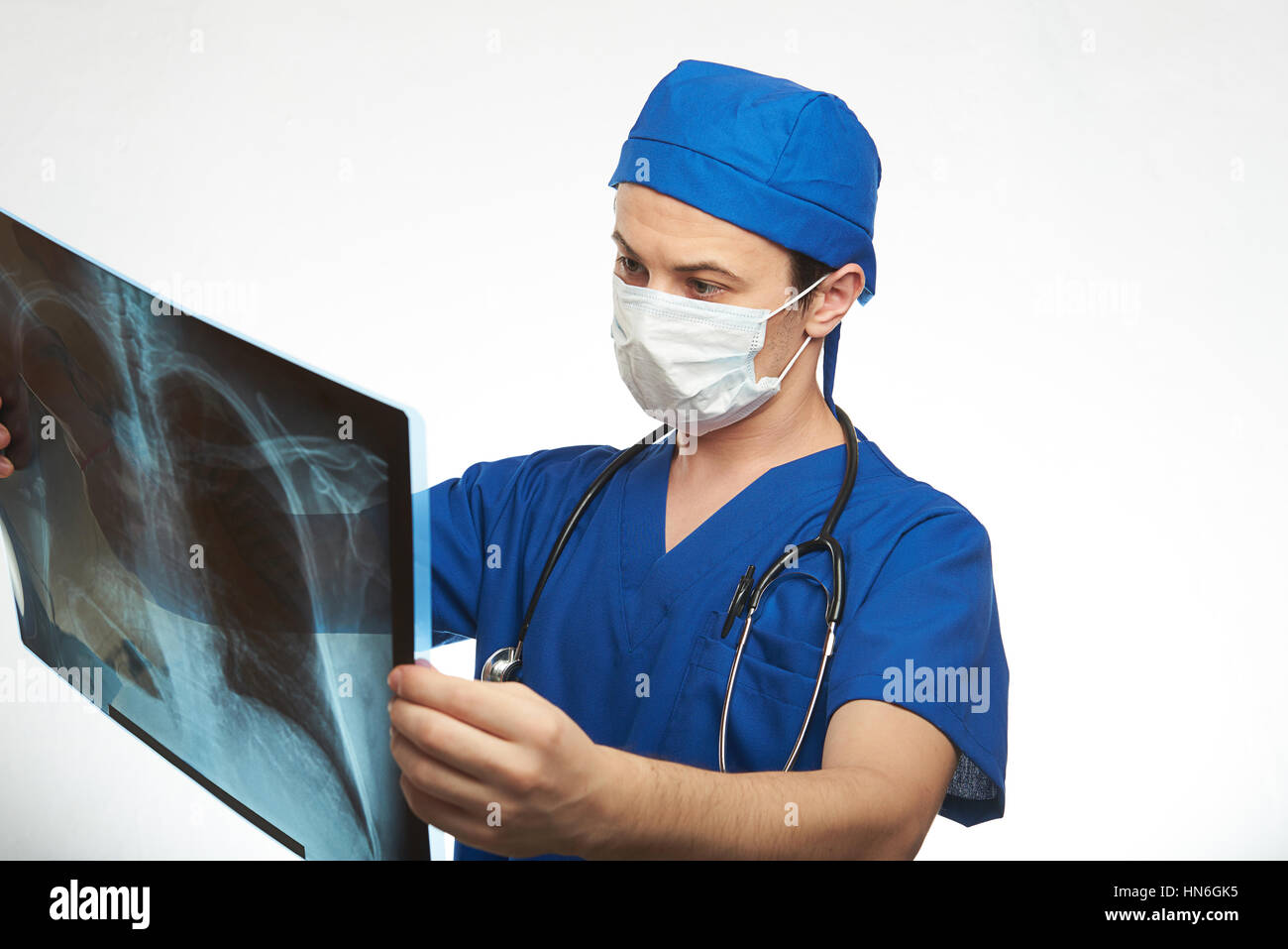 doctor checking x-ray photo of chest isolated on white Stock Photo - Alamy
