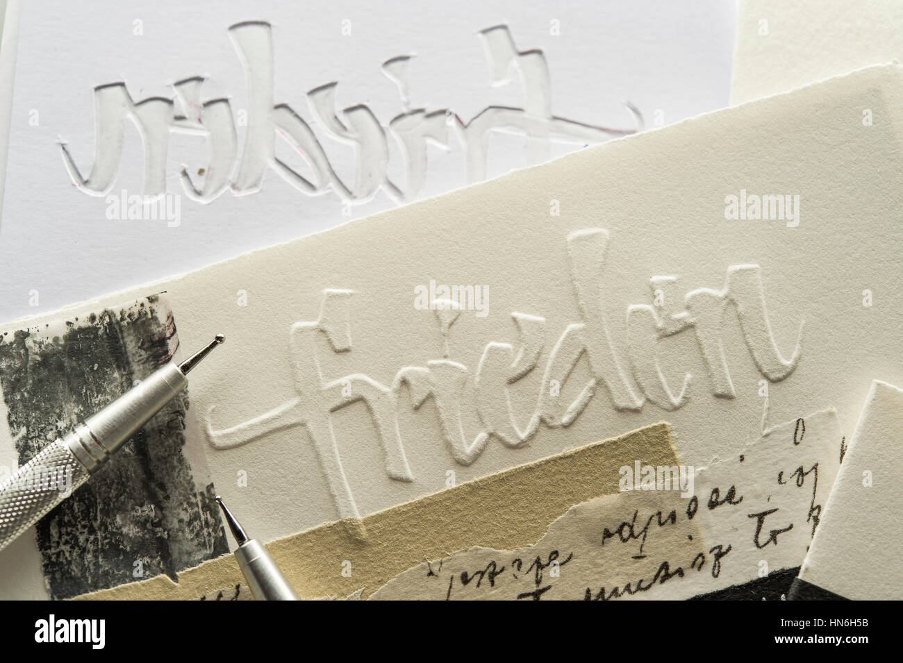 Calligraphy studio, card with writing, collage, hand imprints, negative ...