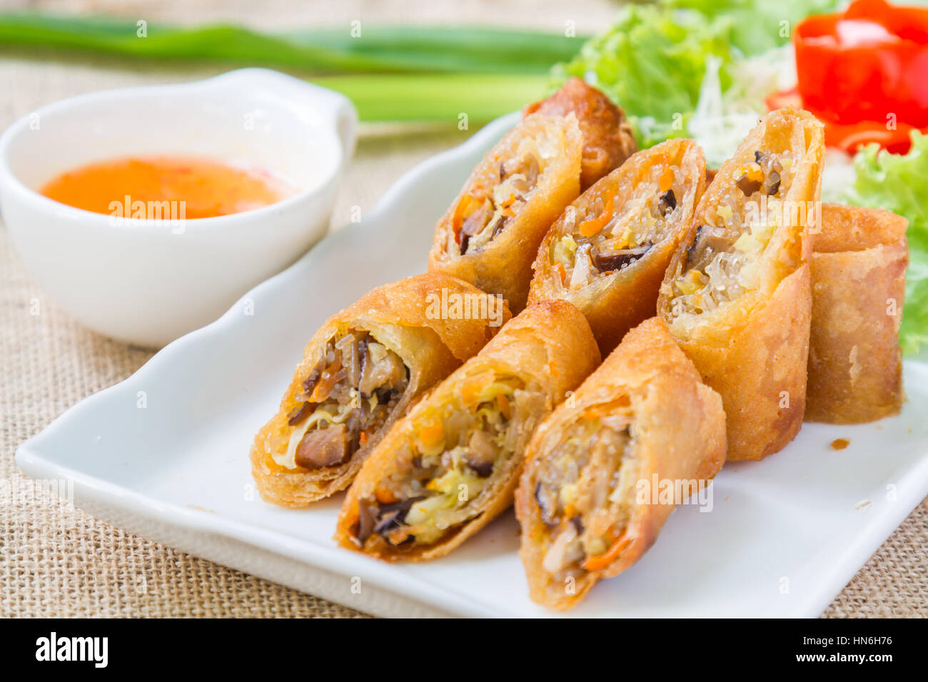 Deep fried spring rolls and sweet sauce on white plate Stock Photo - Alamy