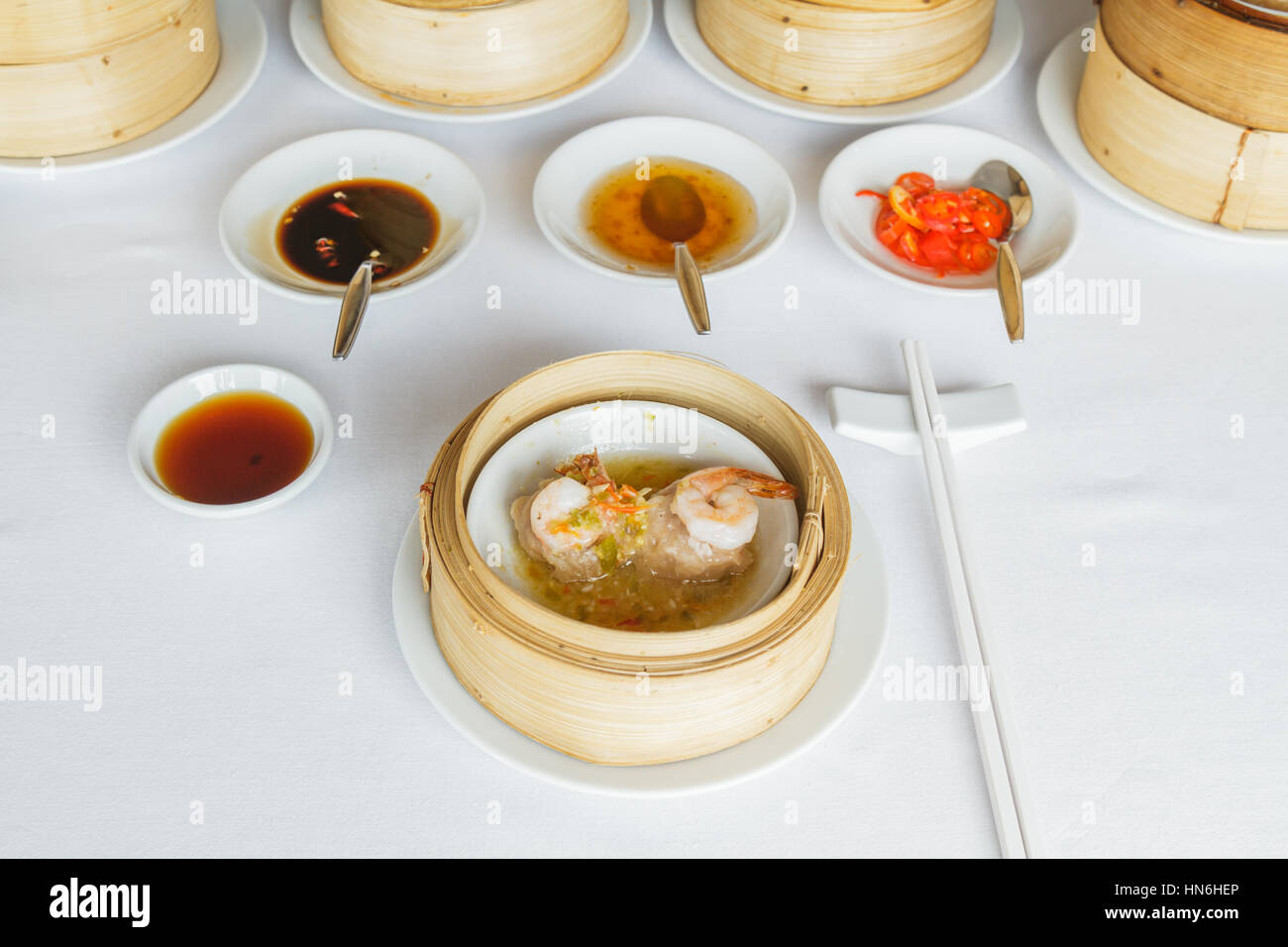 Dim sum food Steamed shrimp in spicy sauce in bamboo basket at ...