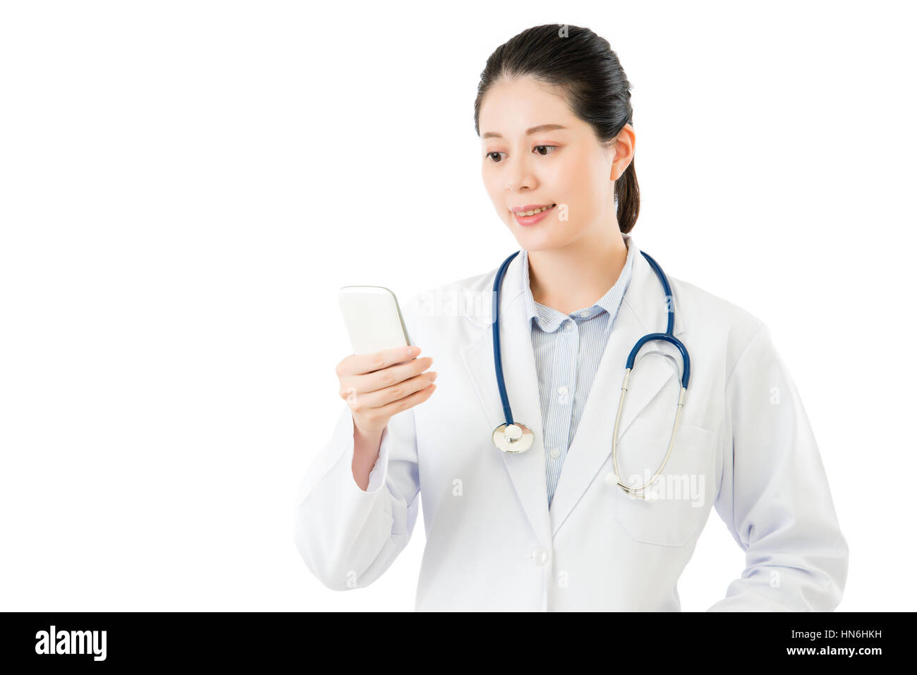 beautiful asian doctor using smartphone. isolated on white background ...