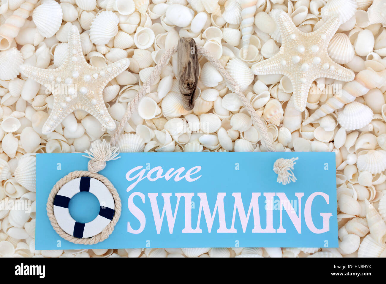 Gone swimming sign with starfish and white seashell assortment Stock ...