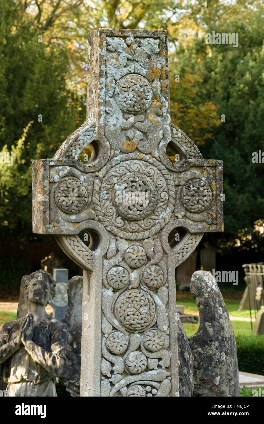 Ornate stone Celtic Cross headstone in graveyard of St Mary Magdalene ...