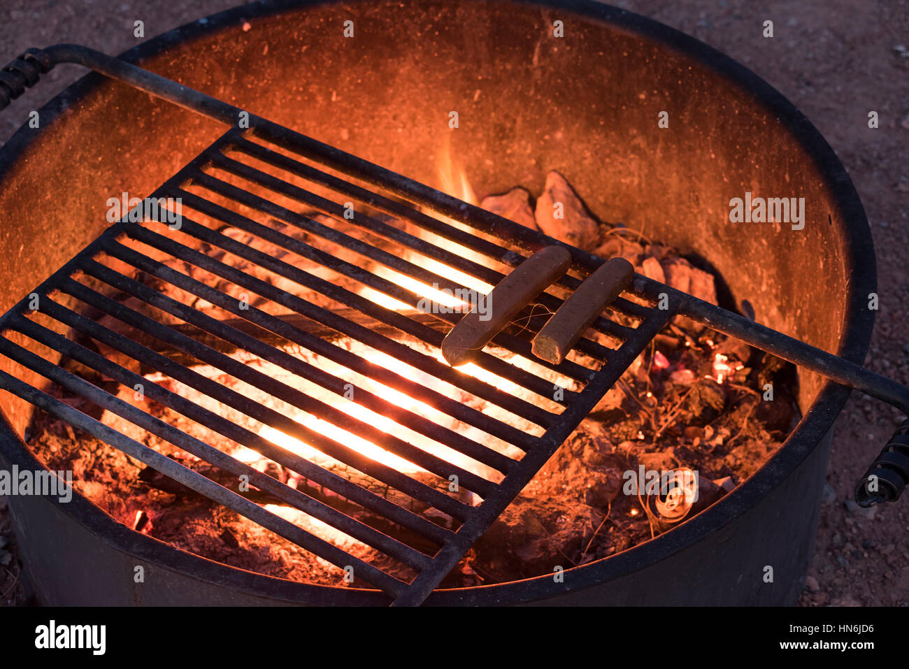 Vegan sausages roasting in a campfire Stock Photo - Alamy