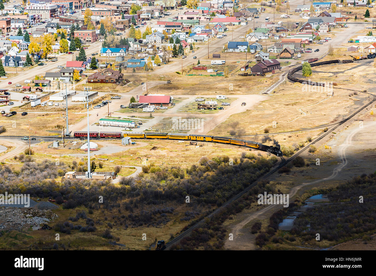 Aerial view of Silverton, Colorado in the fall with coal train and ...