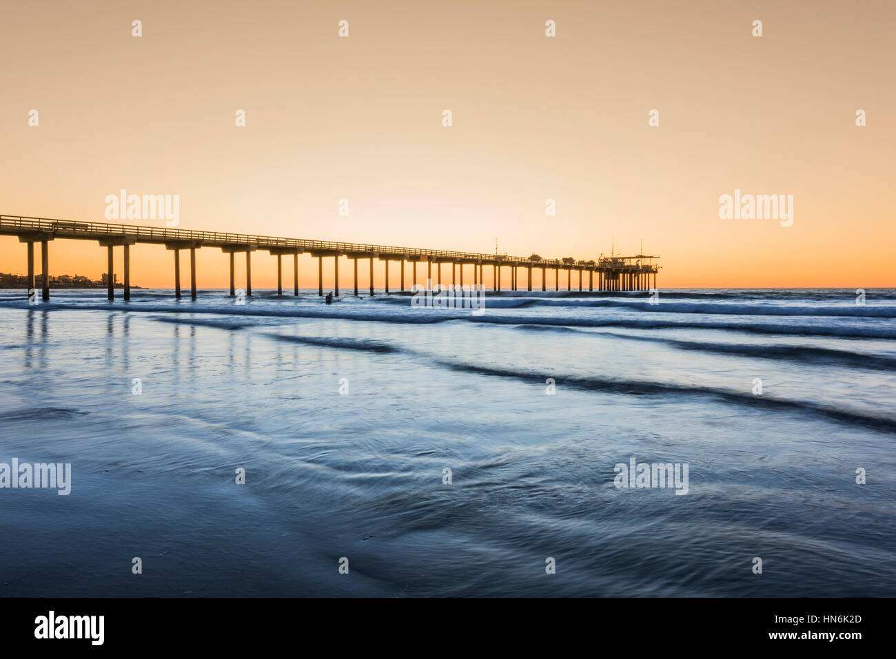 Wide angle shot of Scripps Pier with reflection during sunset in La ...