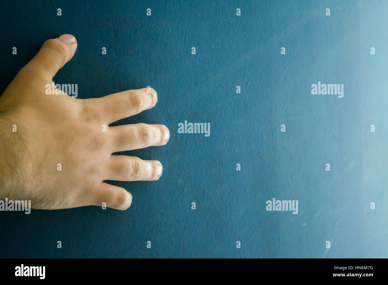 Person touching wall hi-res stock photography and images - Alamy