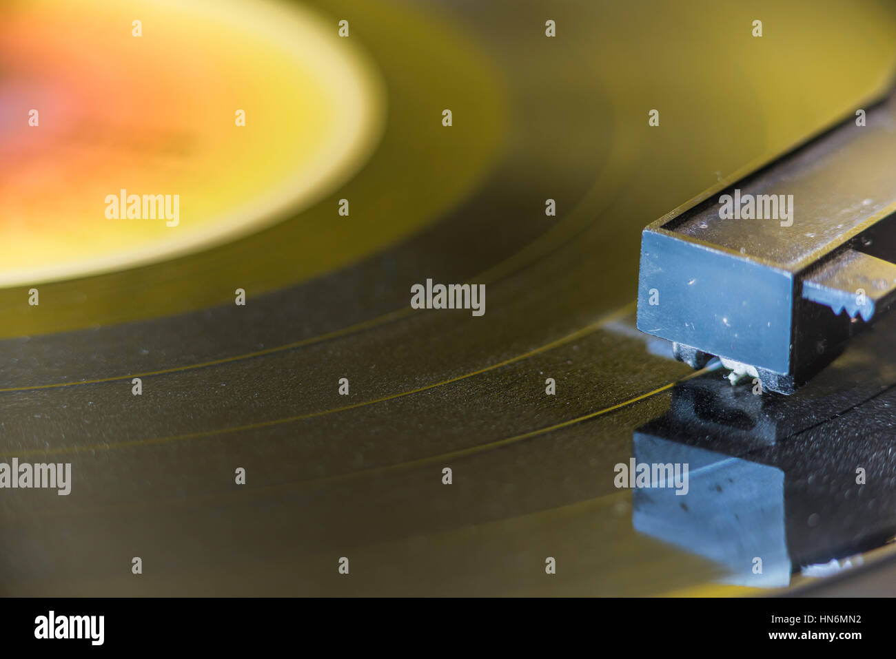 Closeup of old and dusty vinyl record player with arm and needle in ...