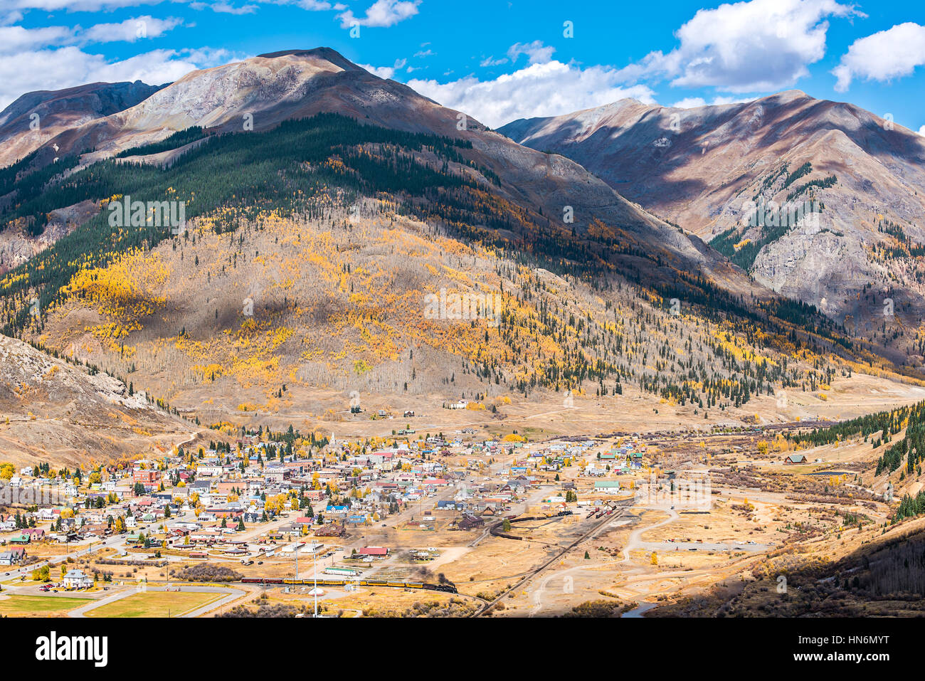Aerial view of Silverton, Colorado in the fall with coal train and ...