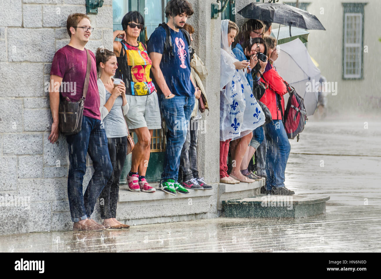 Man rain hiding hi-res stock photography and images - Alamy