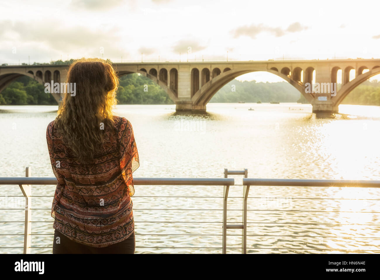 Woman standing bridge over river architecture hi-res stock photography ...
