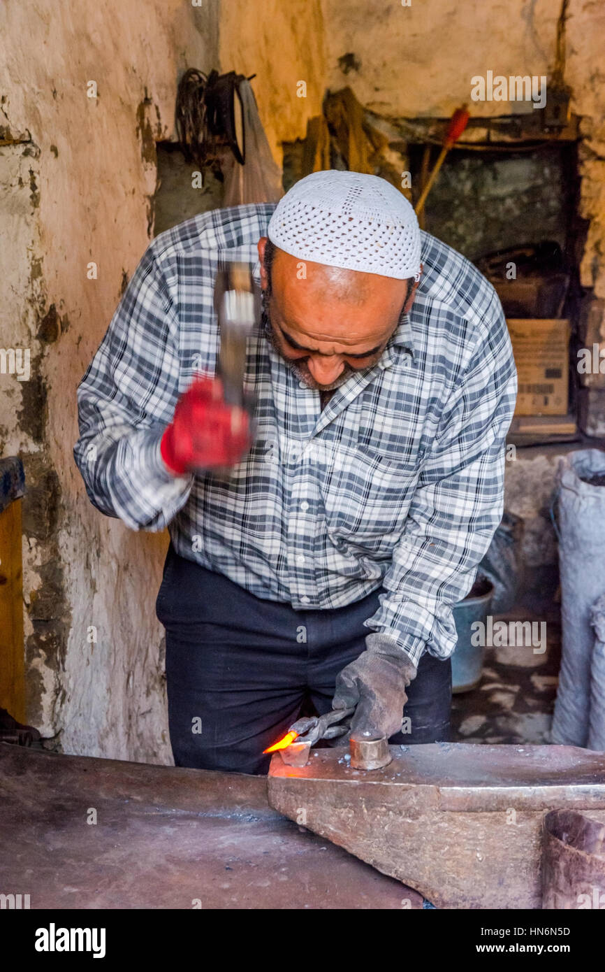 LAHICH, AZERBAIJAN - OCTOBER 1: Senior blacksmith making nails with ...