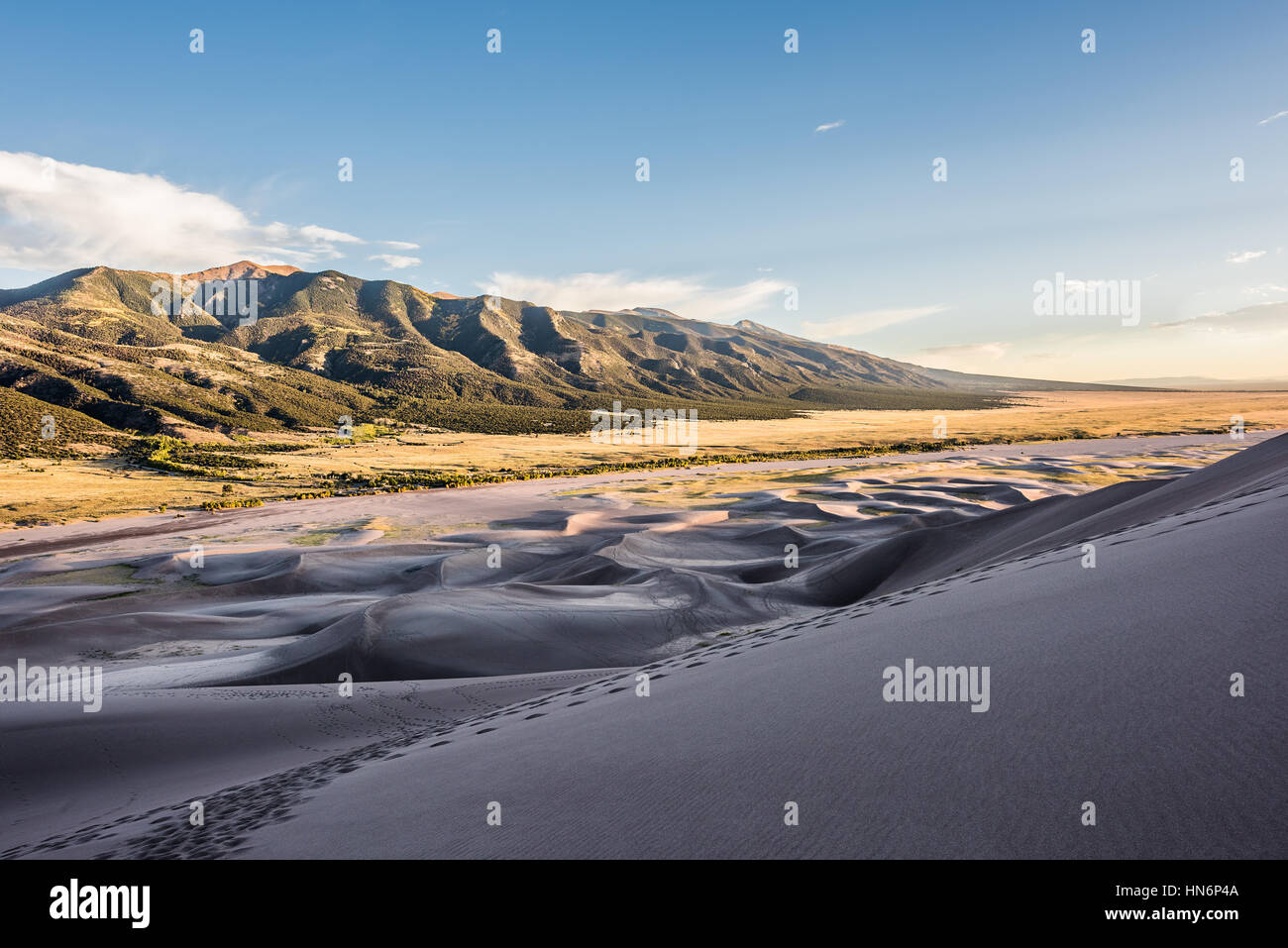 Great Sand Dunes in Colorado with footprints trail path and mountains ...