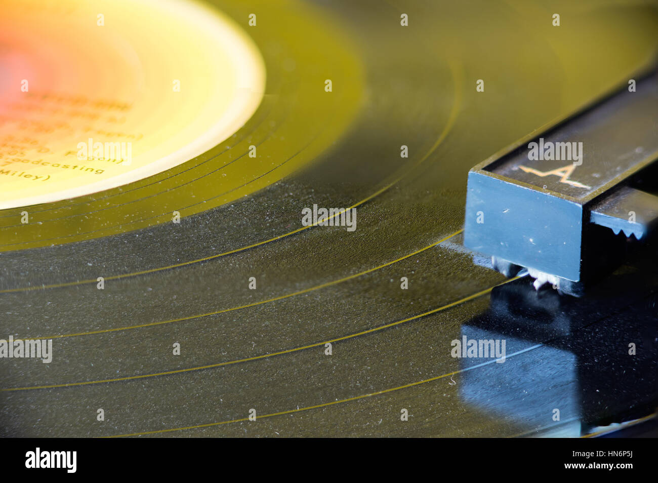 Closeup of old and dusty vinyl record player with arm and needle in ...