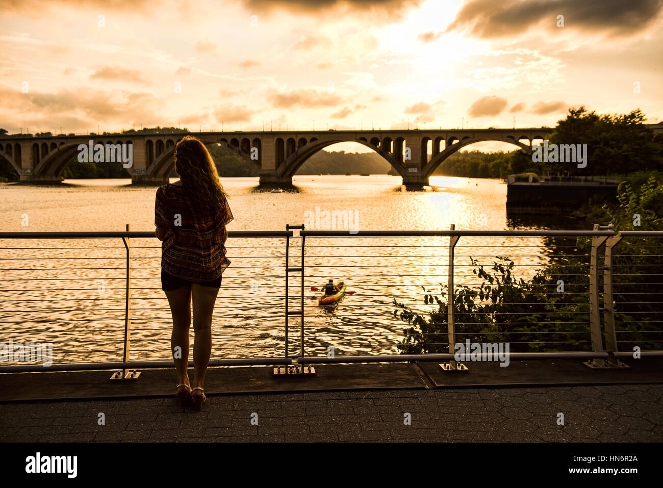 Woman standing bridge over river architecture hi-res stock photography ...