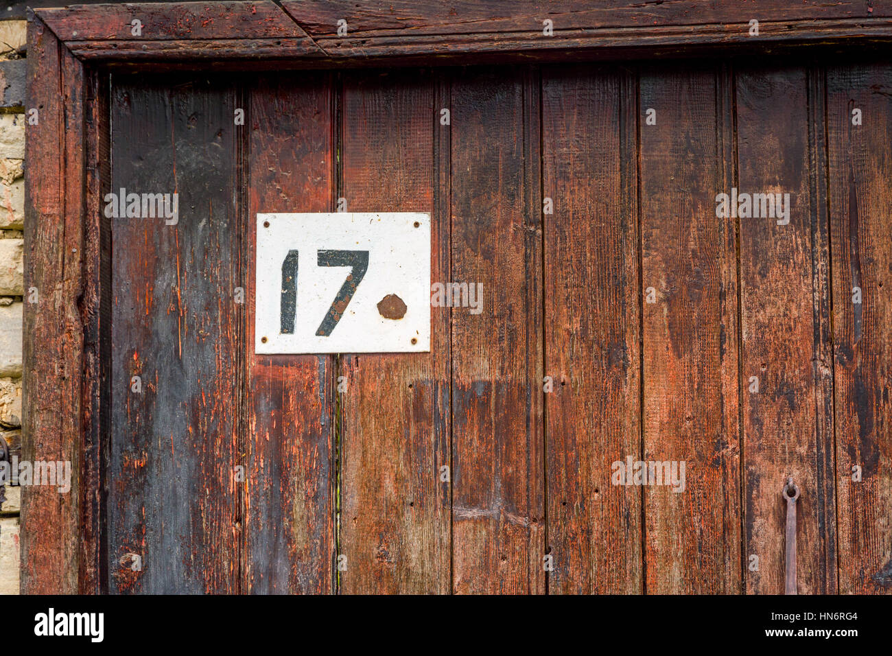 House number 17 on the old style door Stock Photo - Alamy
