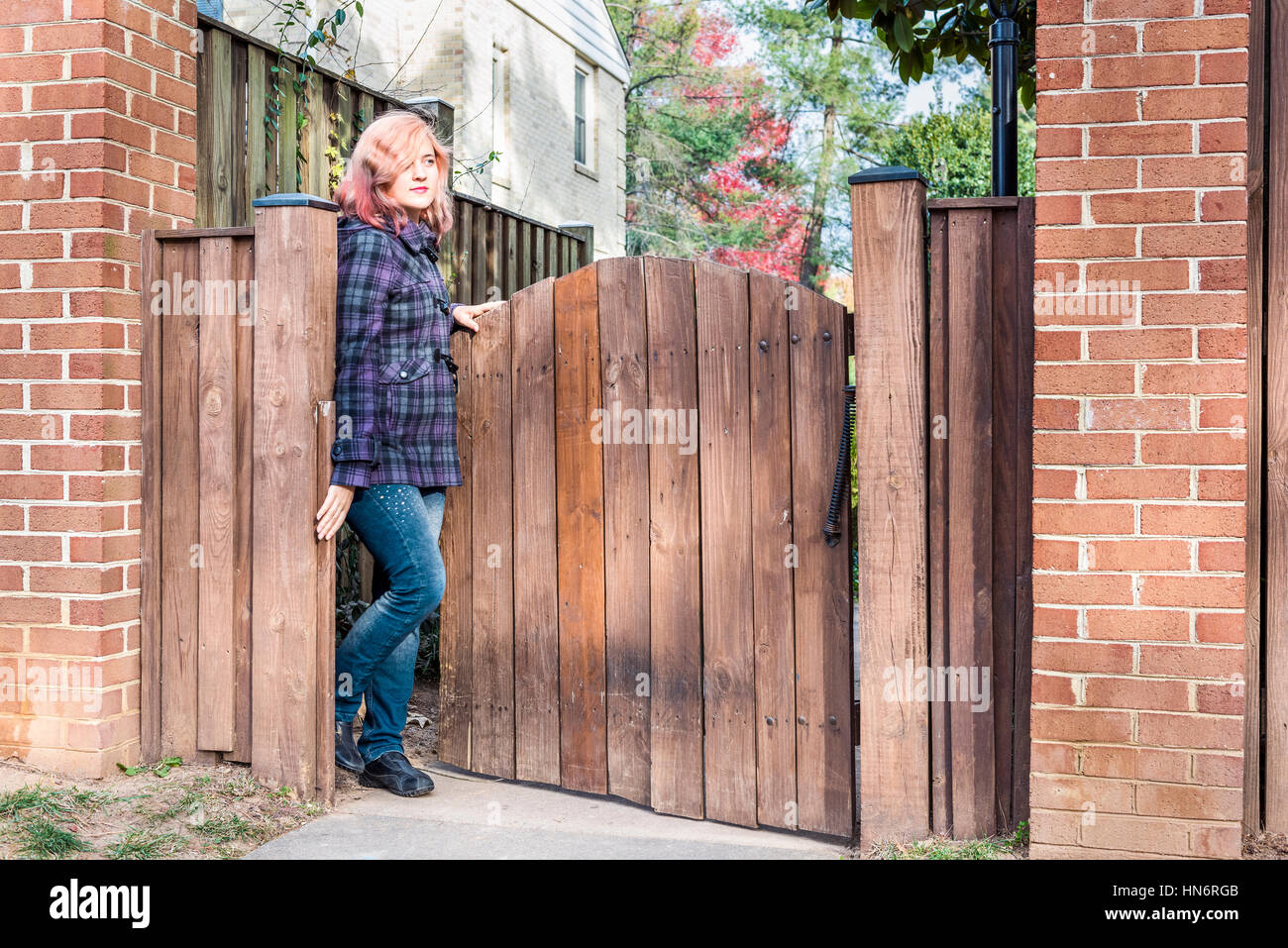 Woman exiting house hi-res stock photography and images - Alamy