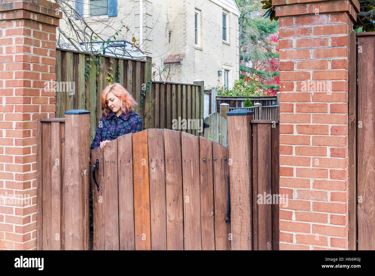 Woman exiting house hi-res stock photography and images - Alamy