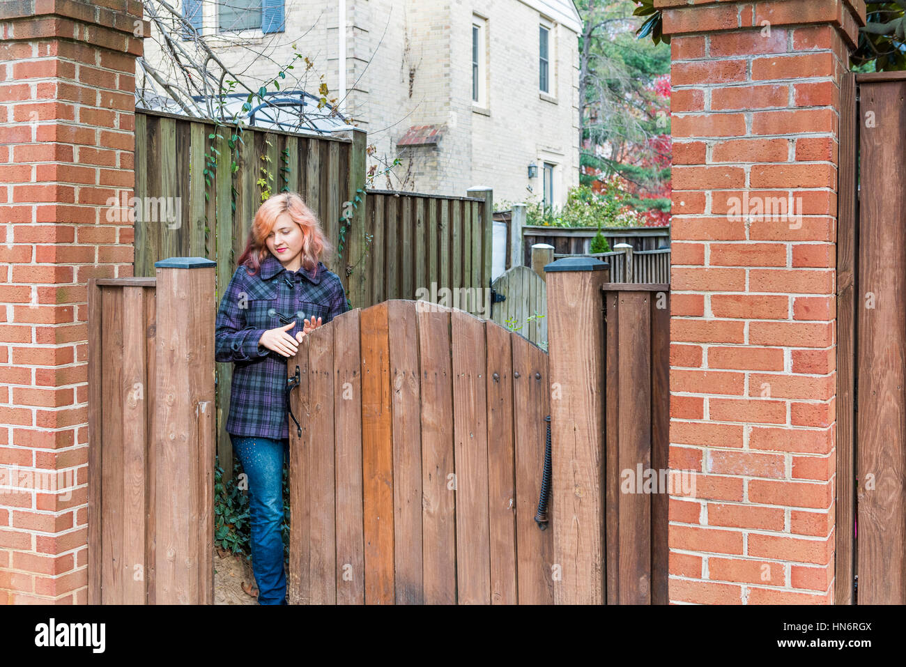 Woman exiting house hi-res stock photography and images - Alamy