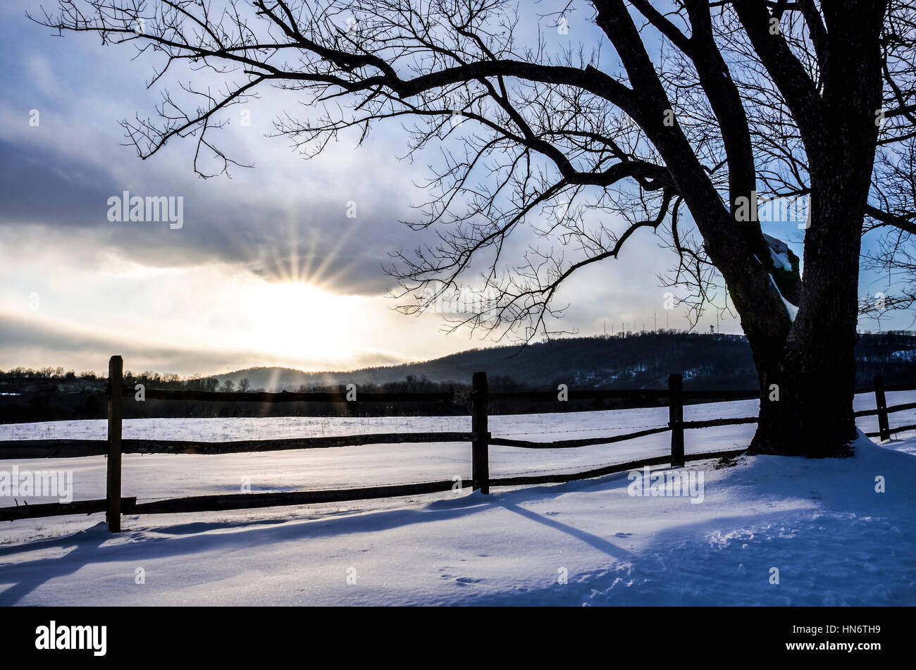 Countryside field in Virginia covered in snow during winter with sunset ...