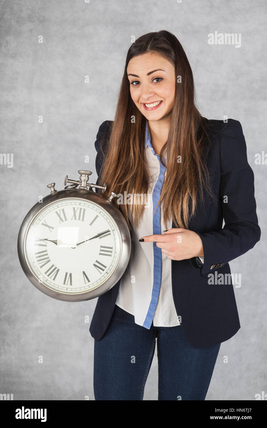 happy business woman pointing to the hour Stock Photo - Alamy