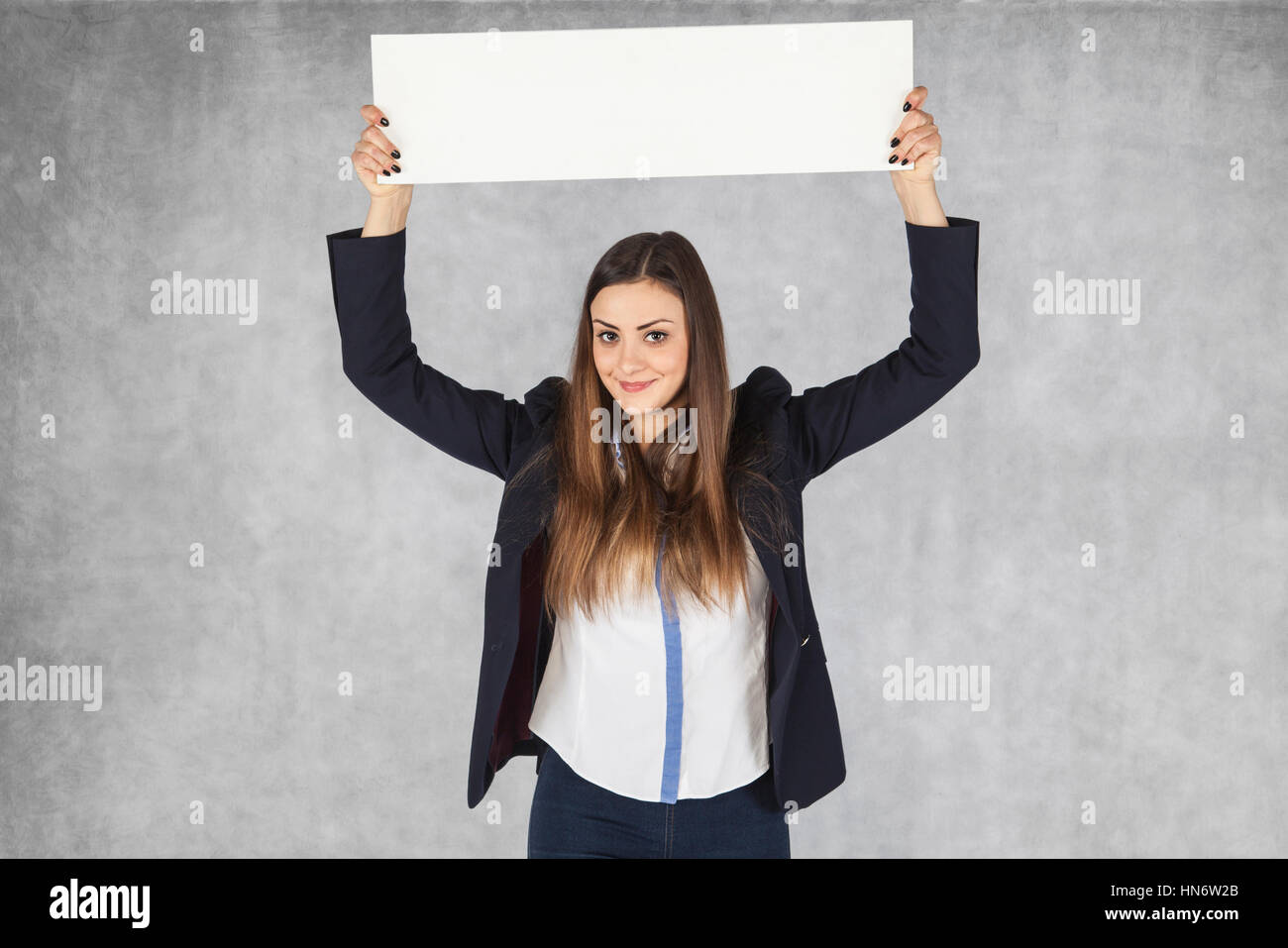 business woman holding ad overhead Stock Photo - Alamy
